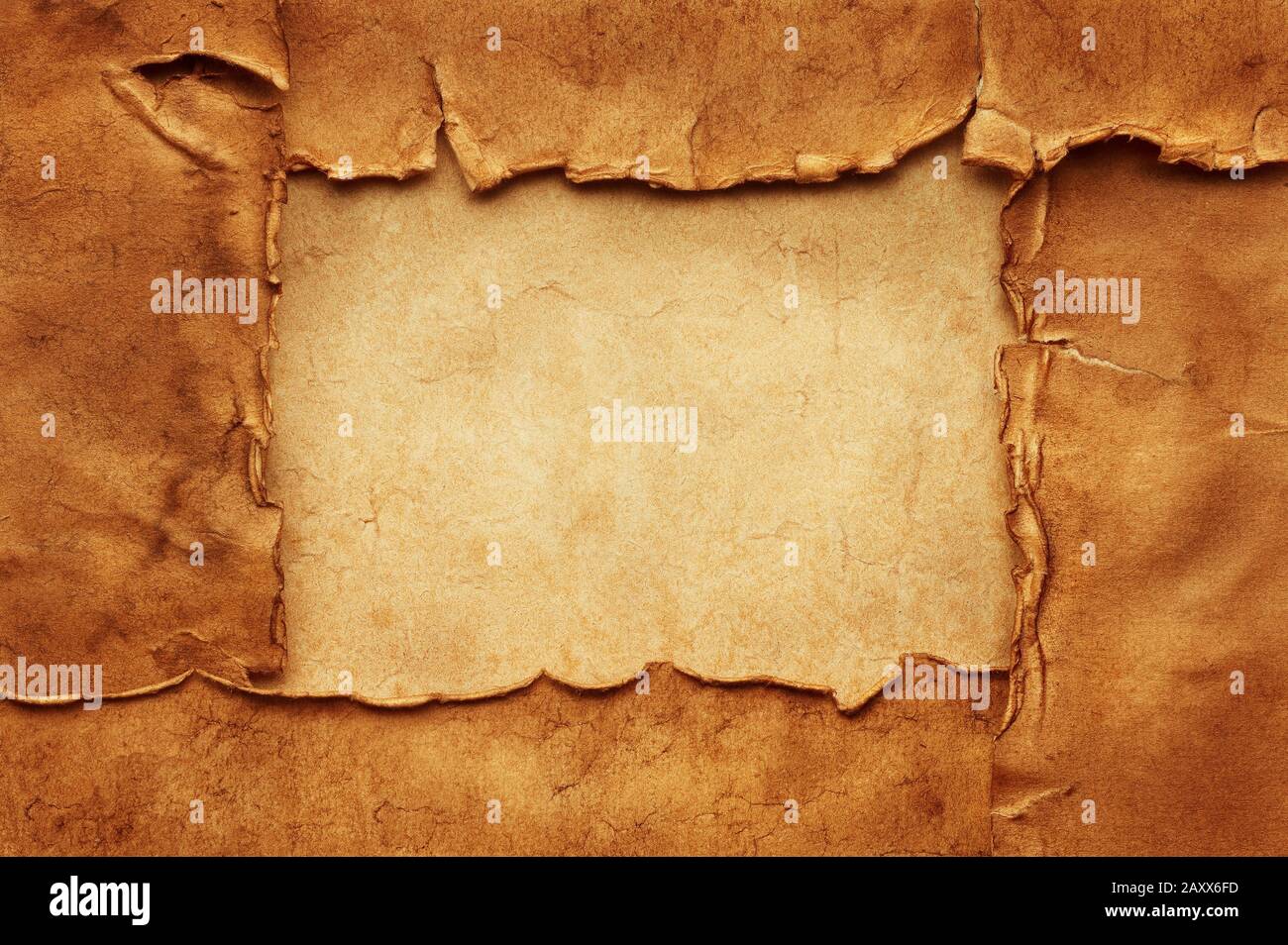 Four old crumpled torn ancient sheets of paper on another vintage sheet ...