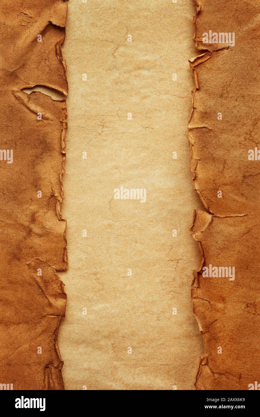 Vertical oriented old crumpled torn ancient sheets of paper on another ...