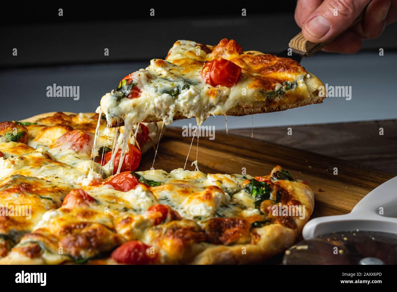 Serving vegetarian pizza Stock Photo - Alamy