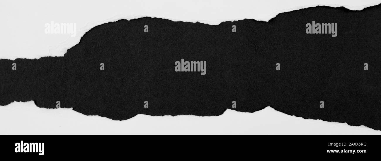 Ripped paper on black background Stock Photo - Alamy