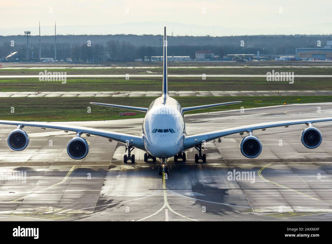 Huge wide-body aircraft on the steering track at the airport after ...