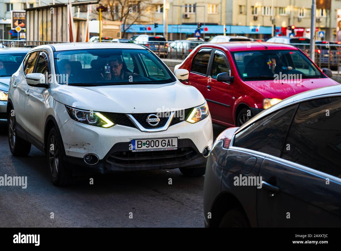 Car traffic at rush hour in downtown area of the city. Car pollution ...