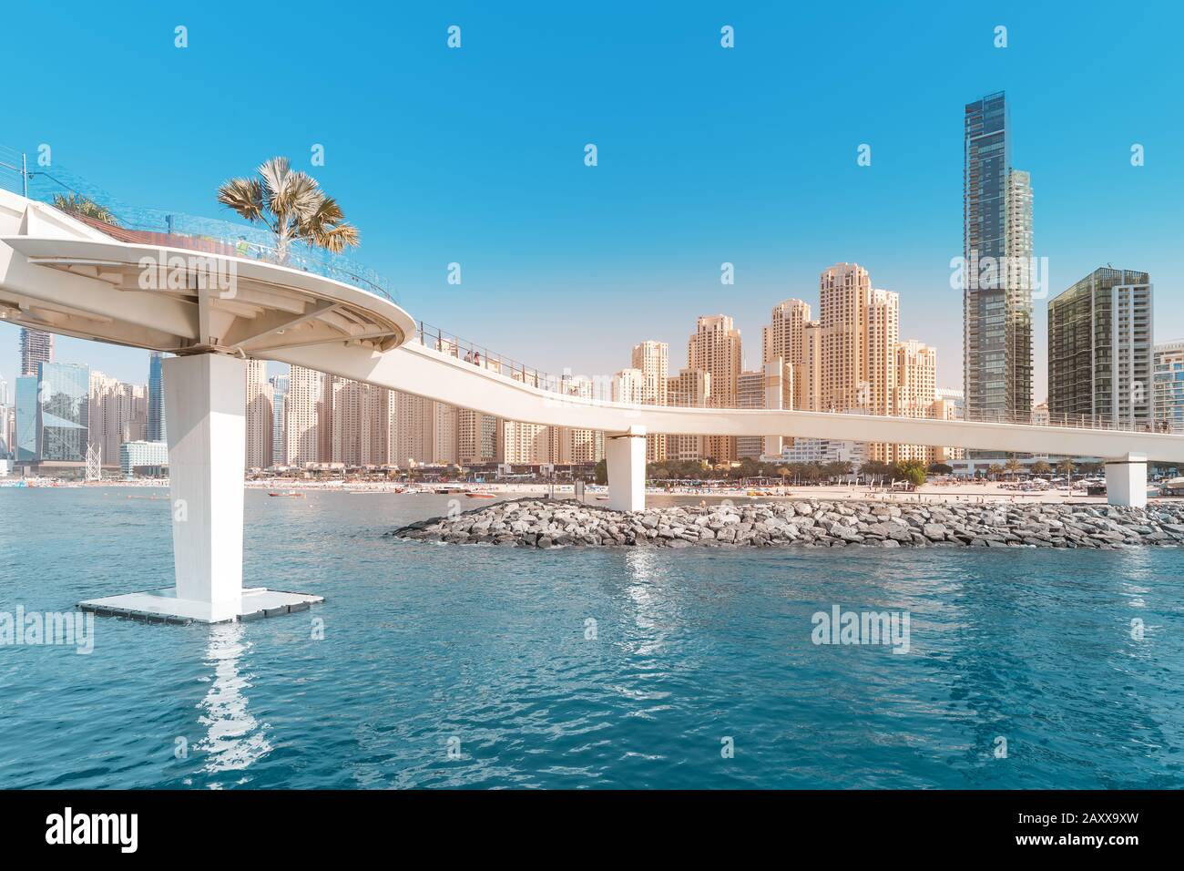 Pedestrian Footbridge at the Dubai Marina harbor with various ...