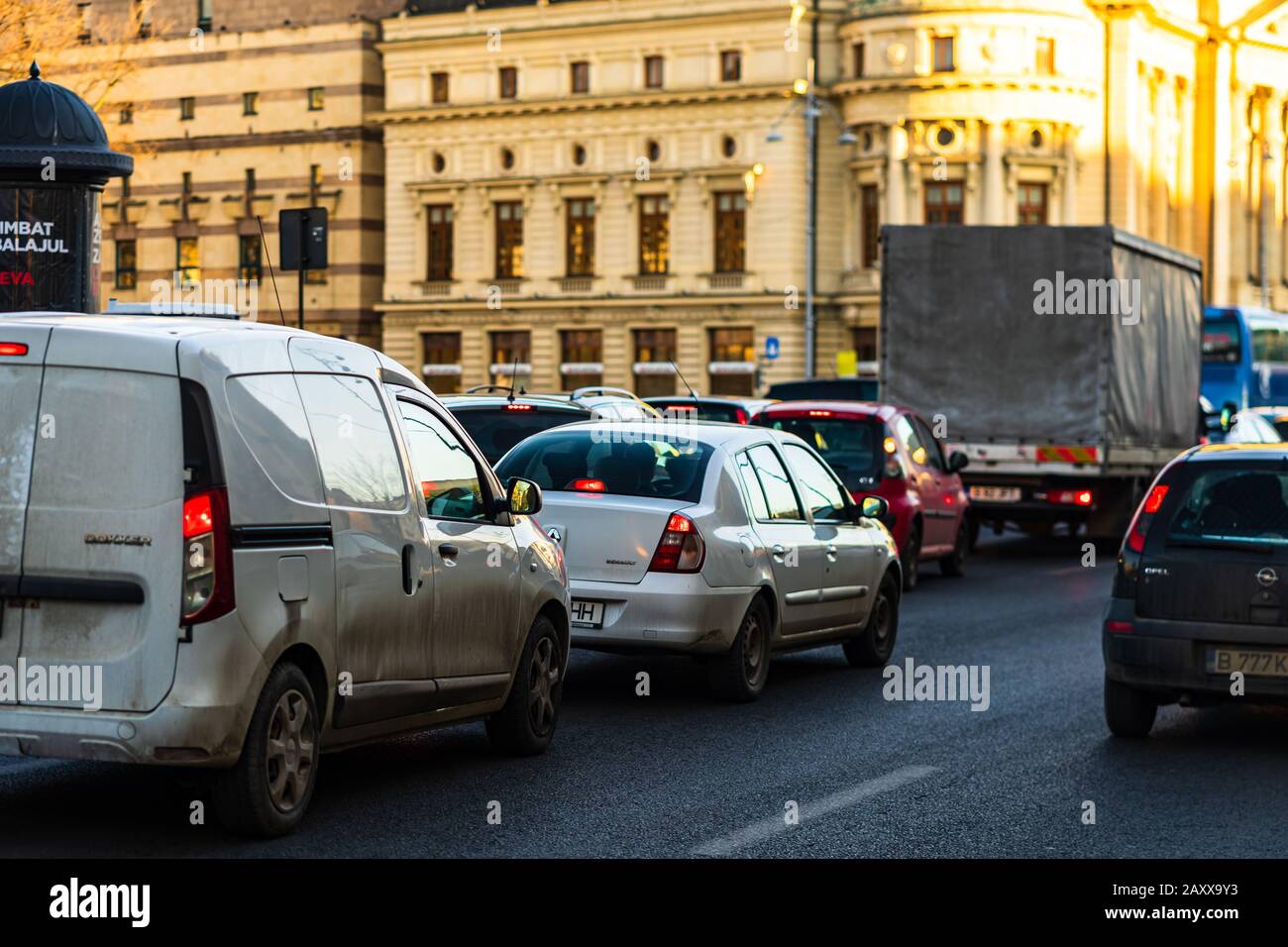 Car traffic at rush hour in downtown area of the city. Car pollution ...
