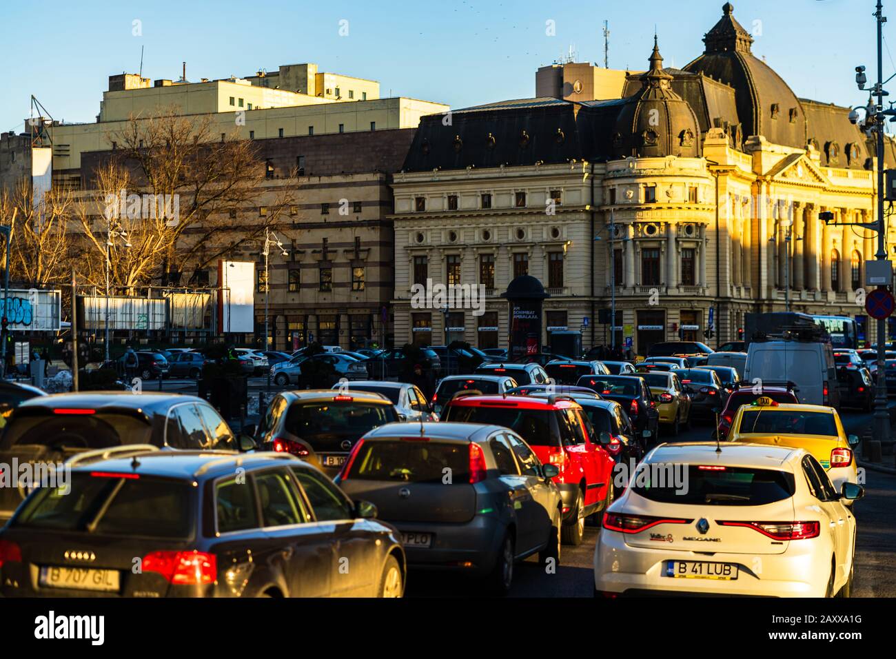 Car traffic at rush hour in downtown area of the city. Car pollution ...
