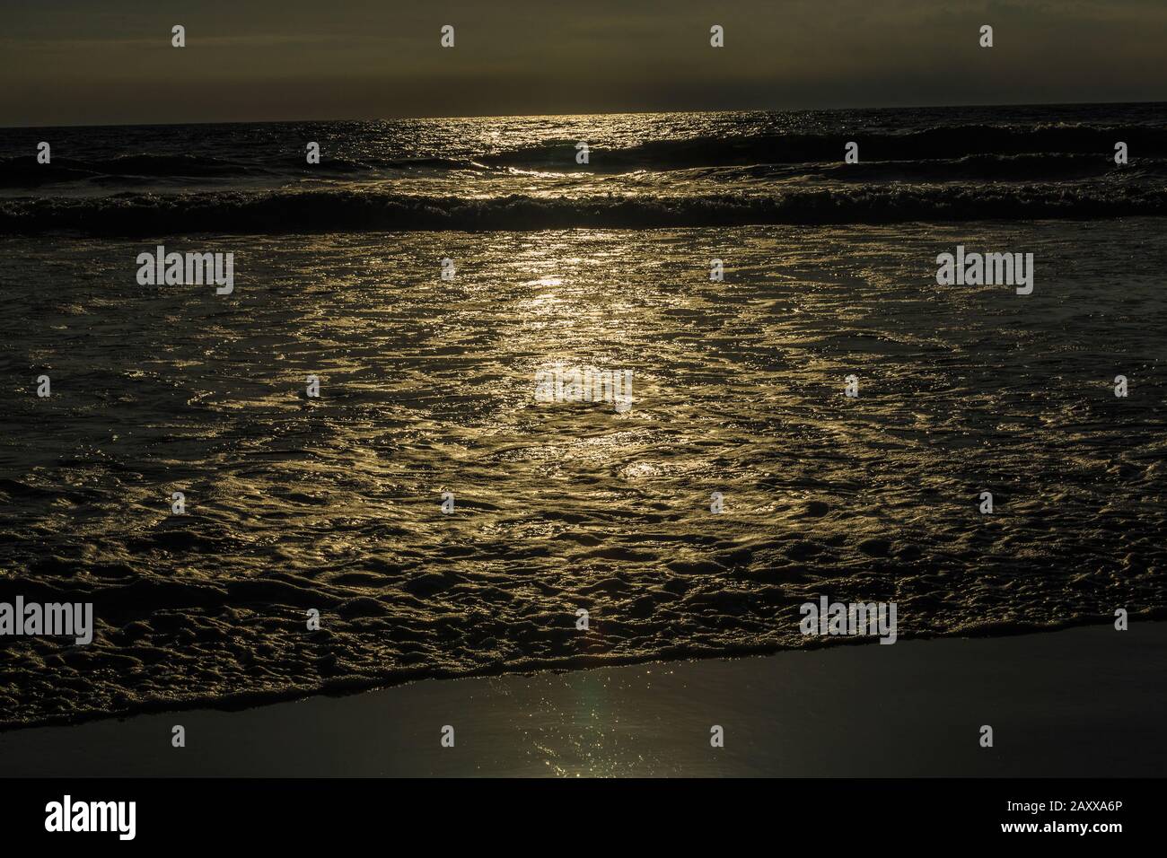 Dark morning surf and sky 1 Stock Photo - Alamy