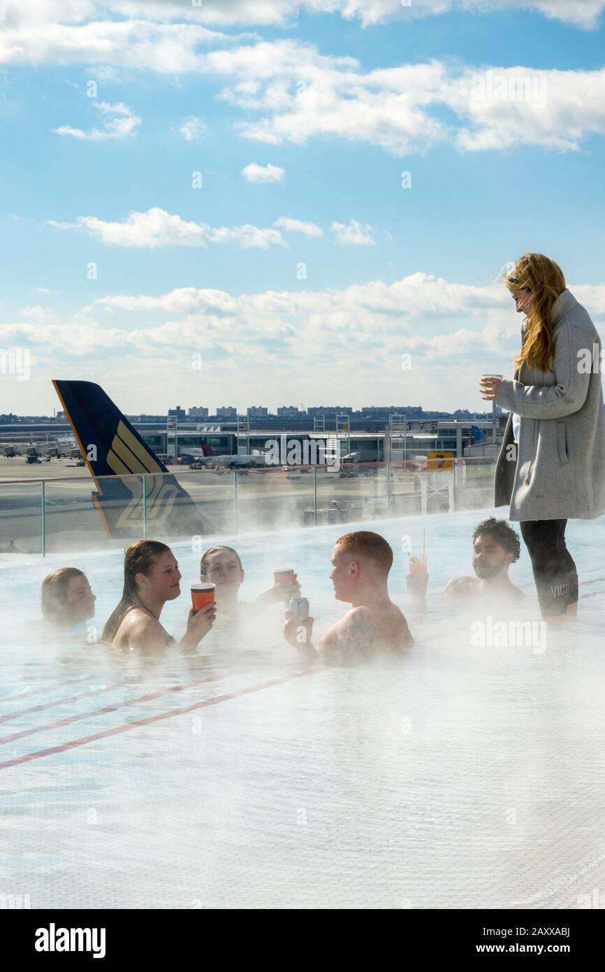 Guests enjoying the rooftop infinity pool at the TWA Hotel at John F ...