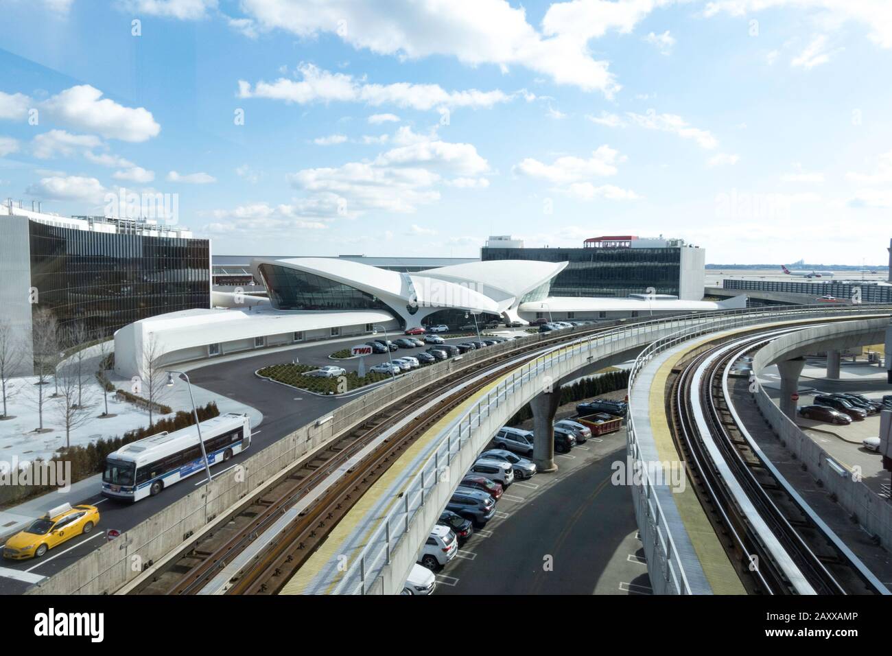 AirTrain tracks at JFK airport with the TWA hotel in background, NYC ...