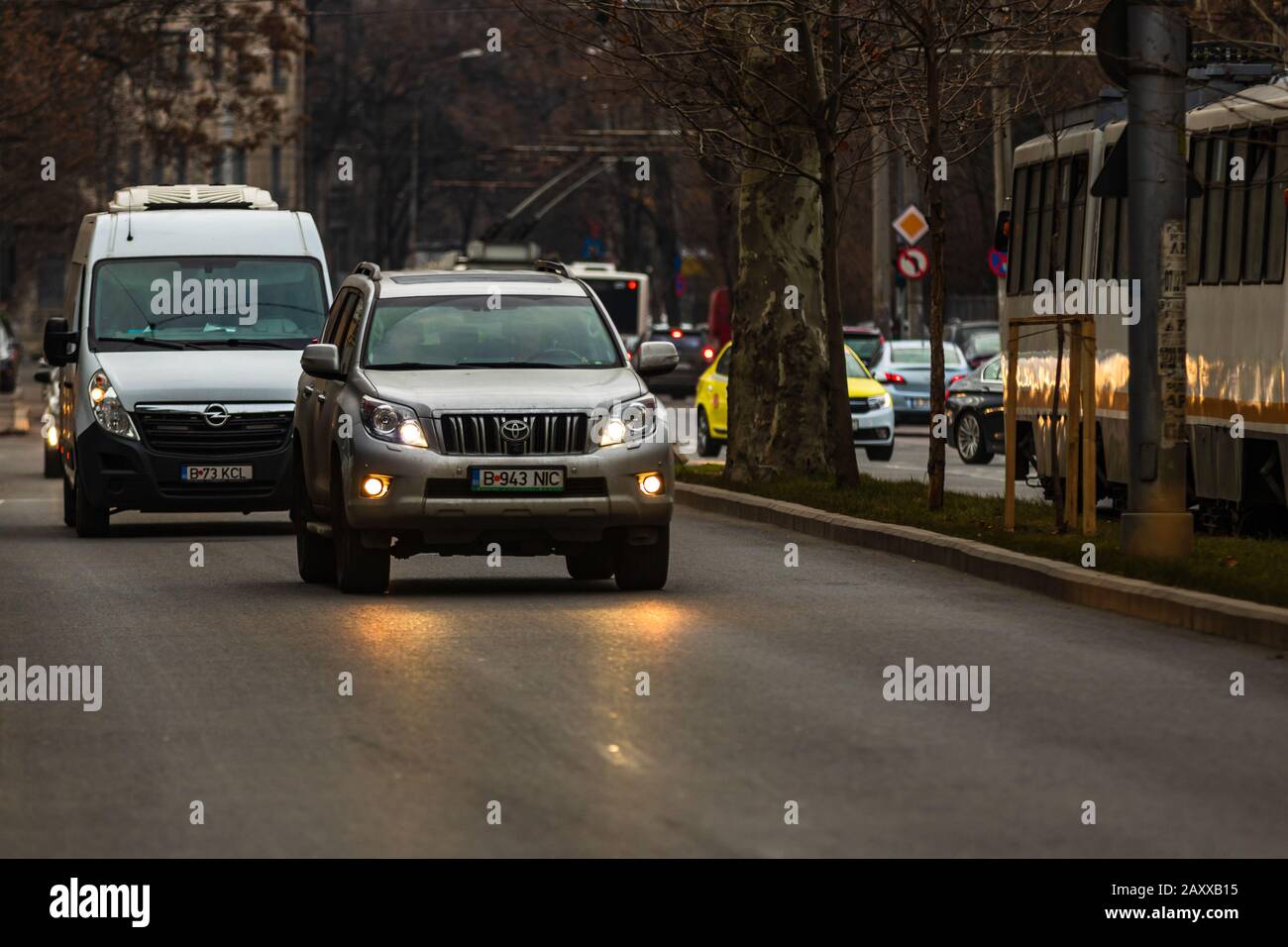 Car traffic at rush hour in downtown area of the city. Car pollution ...