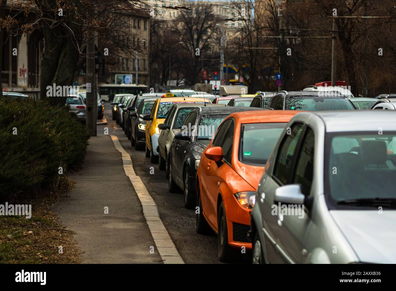Car traffic at rush hour in downtown area of the city. Car pollution ...