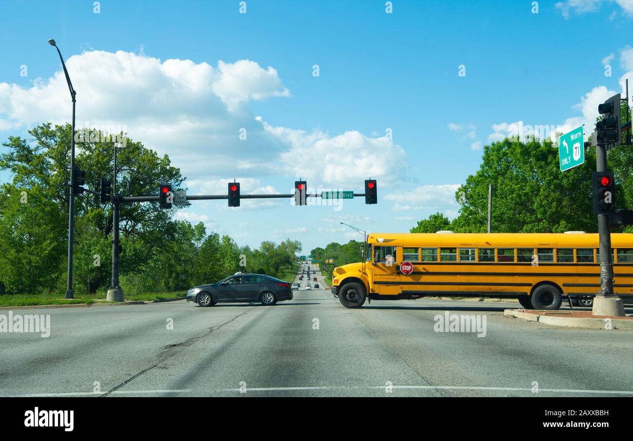 Red lights at intersection in Kansas City with school bus waiting to ...