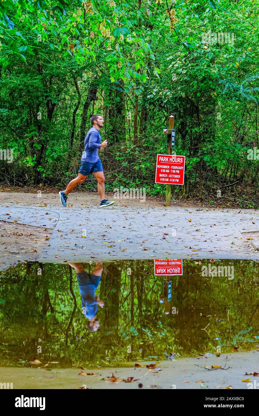 Runner Past Reflection Stock Photo - Alamy