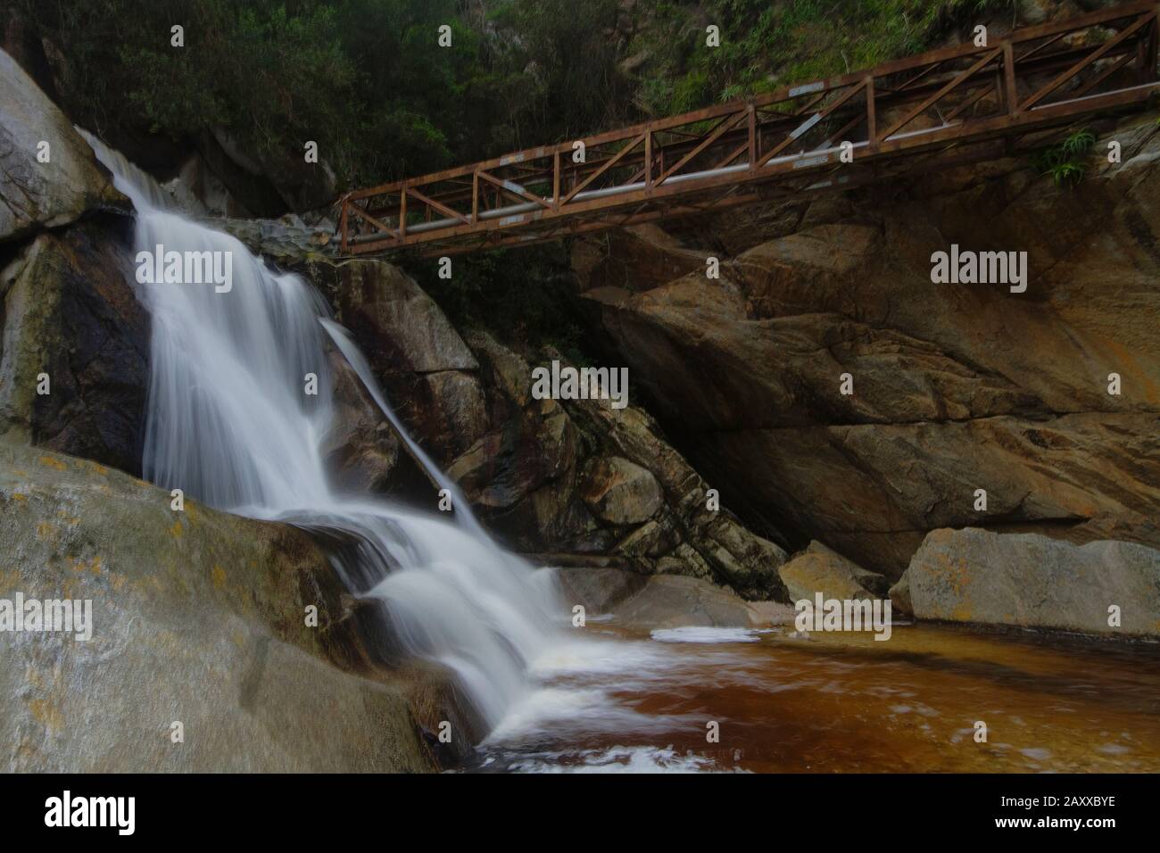 Water pipe going over a tranquil waterfall Stock Photo - Alamy