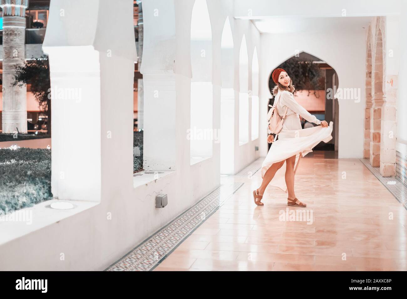 Indian Woman in turban dancing in white exterior of a palace or temple ...