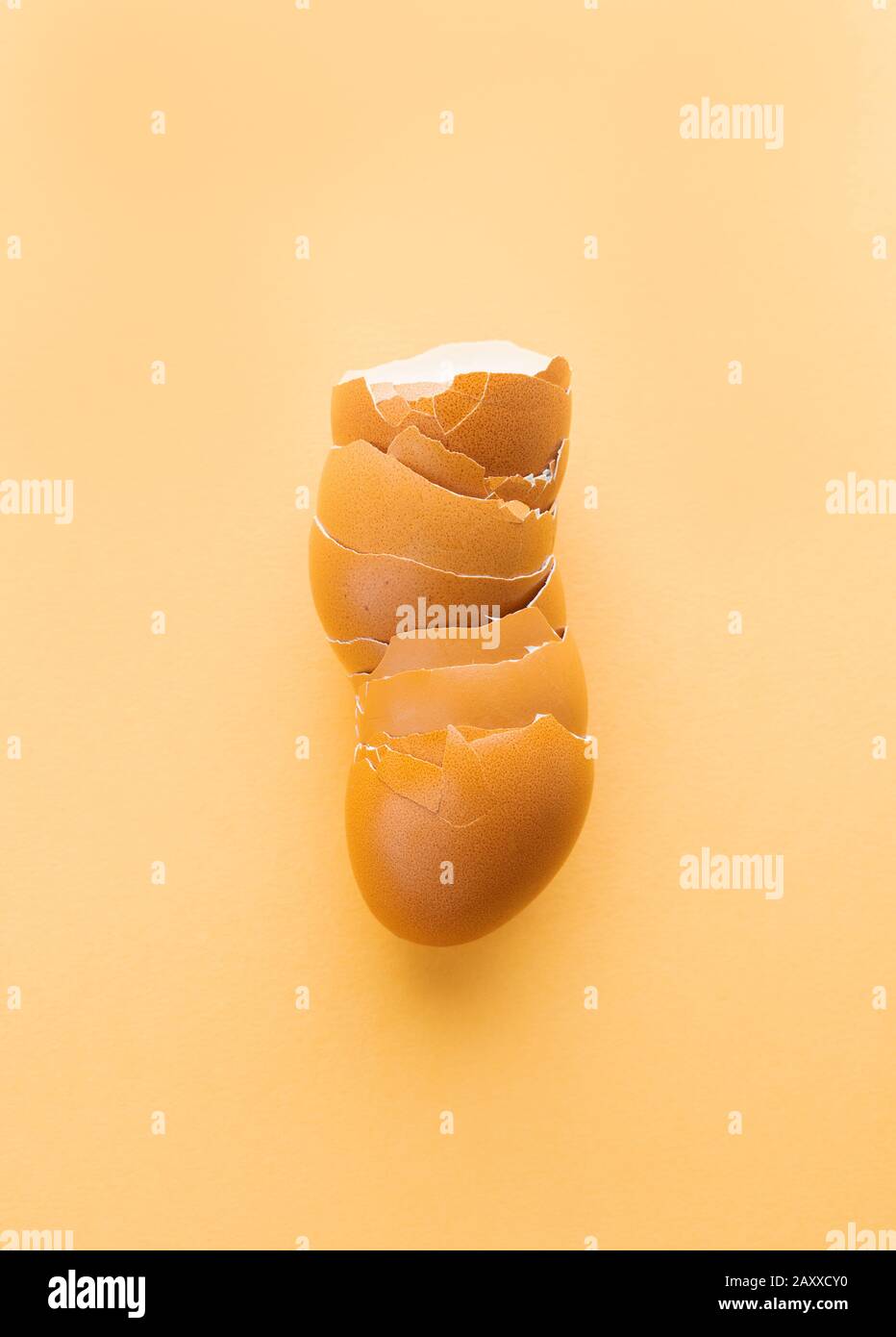 Egg shells on a cream-coloured background. Kitchen concept. Copy space ...