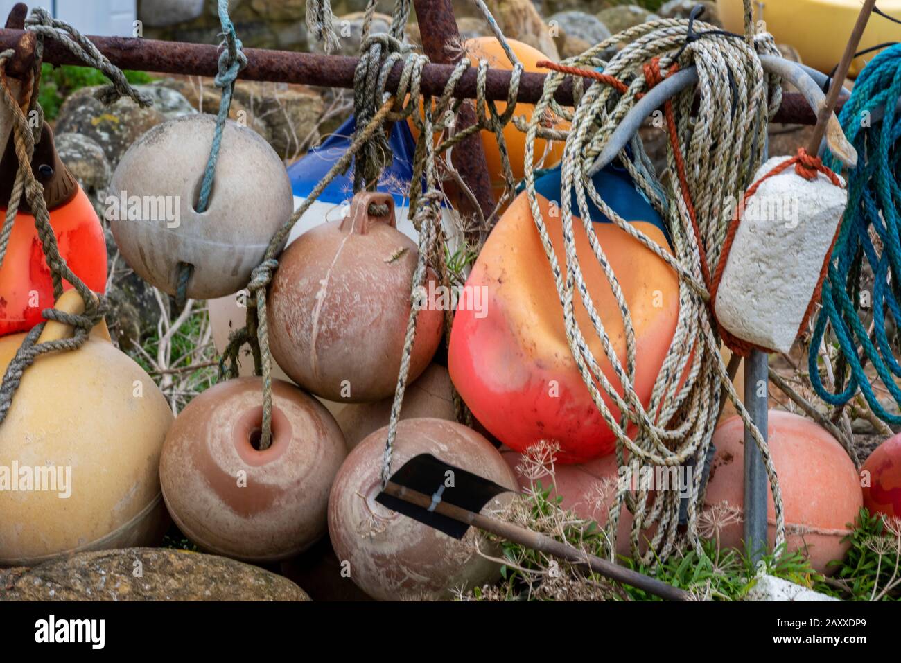 old plastic fishing floats, equipment and nets with wires and ropes at ...