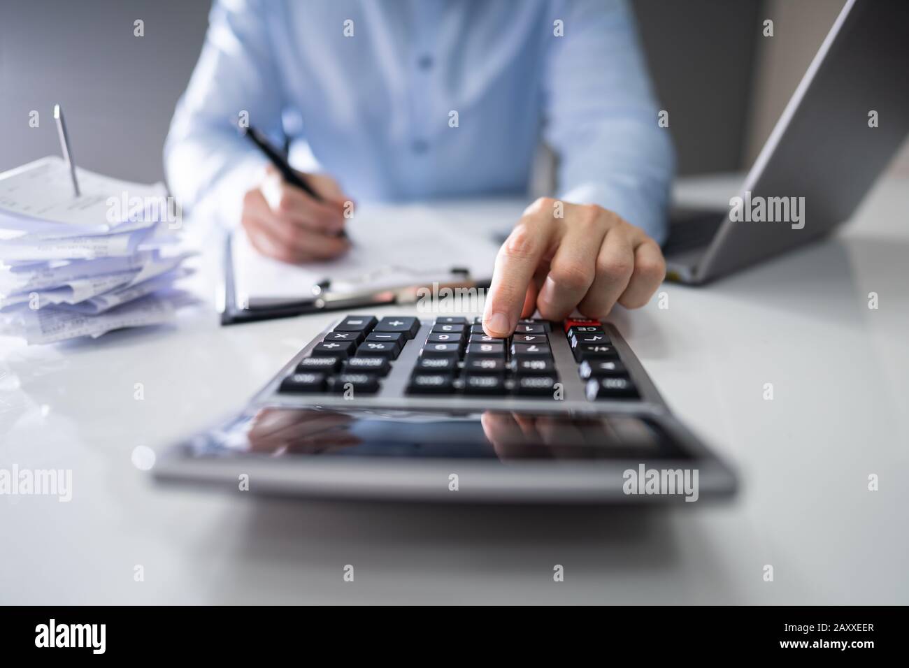 Calculating expense hi-res stock photography and images - Alamy