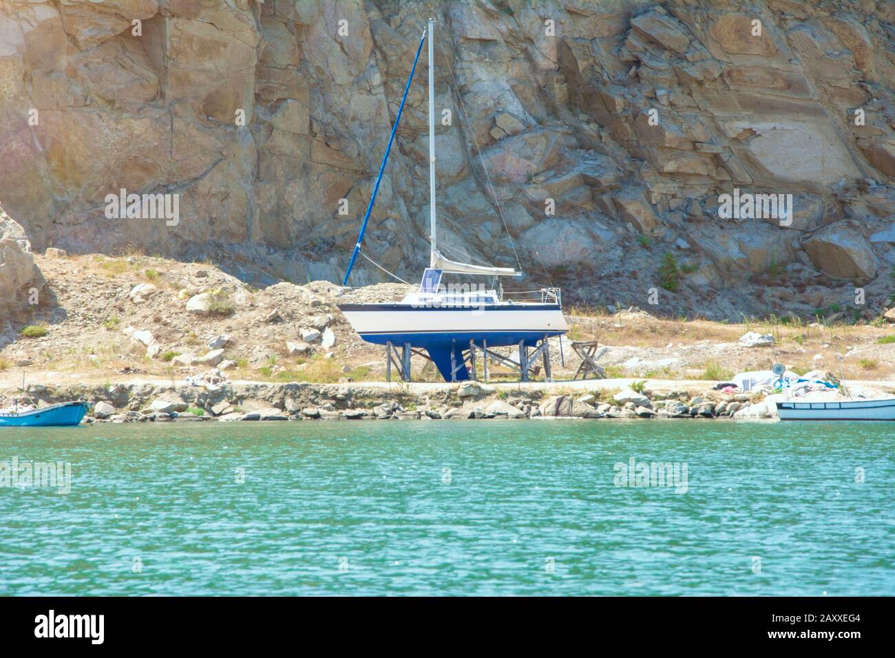 a small fishing boat on land Stock Photo - Alamy
