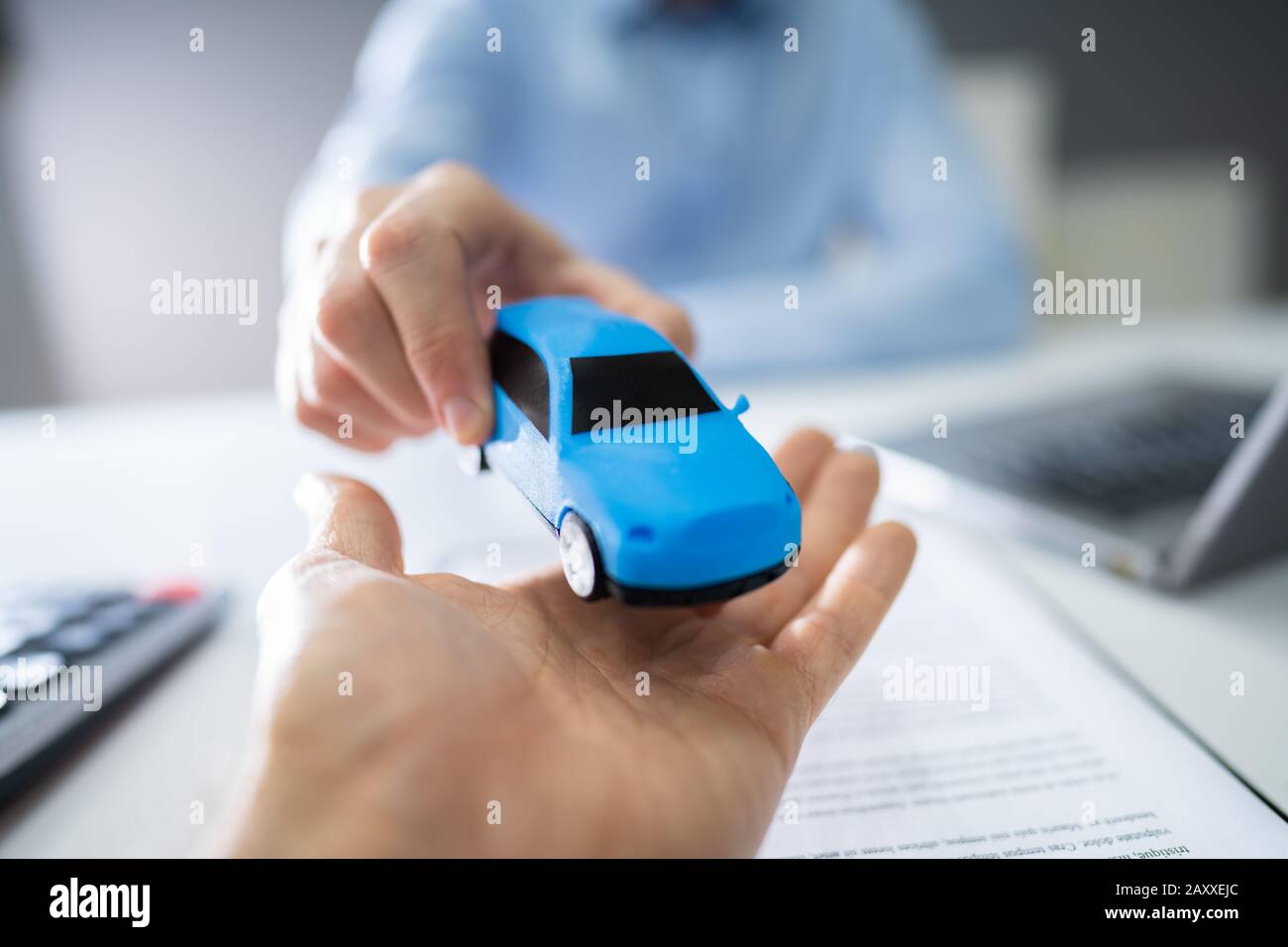 Close-up Of Salesman Hand Giving Car To Man Stock Photo - Alamy