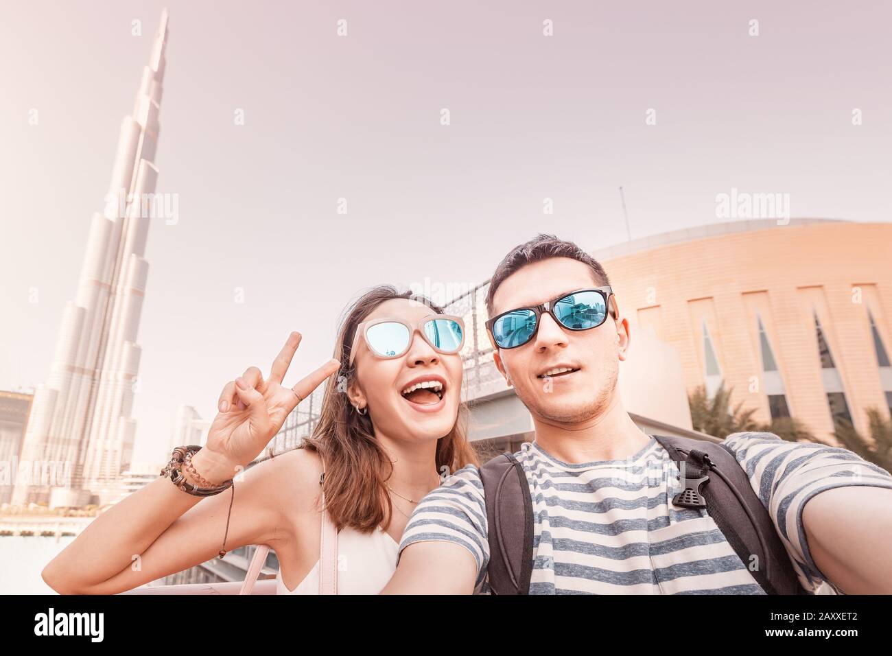 Two friends a man and a woman travel in Dubai and take a selfie photo ...