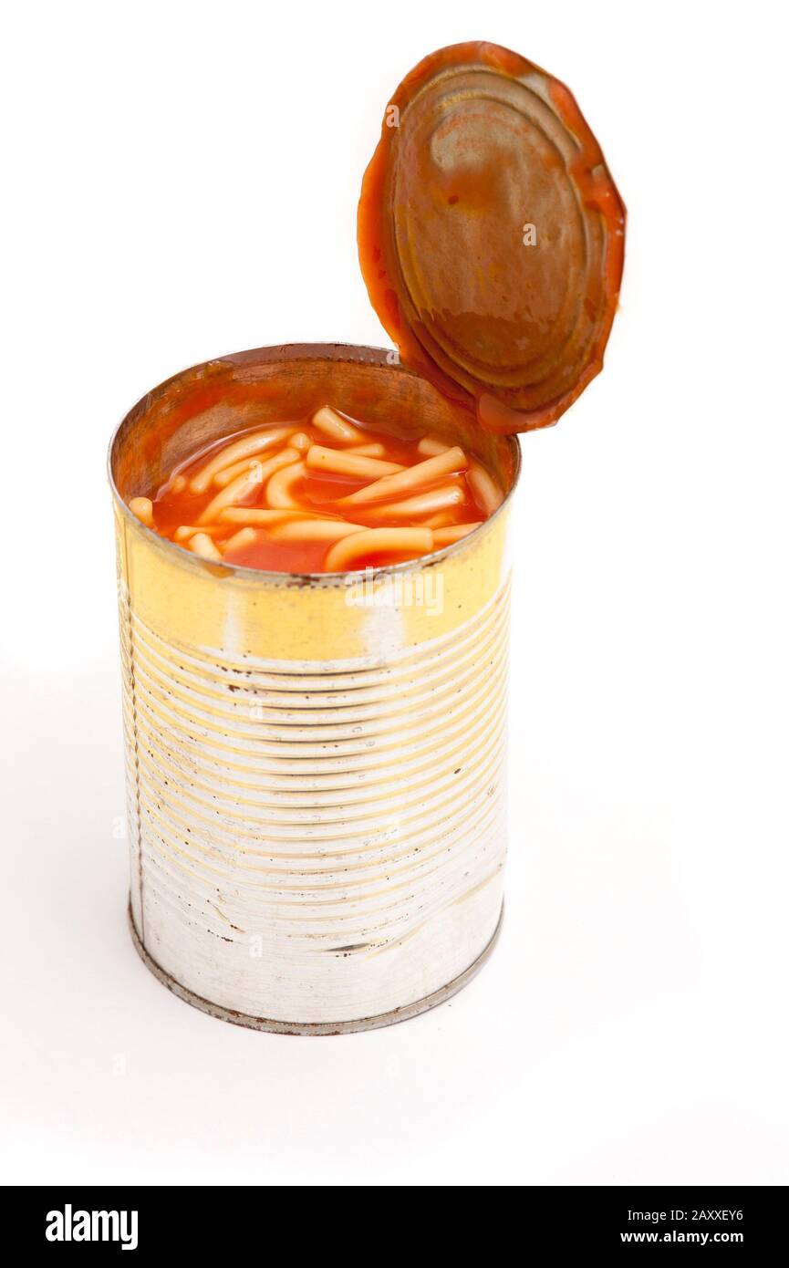 Opened unlabelled tin of canned spaghetti in tomato sauce on a white ...