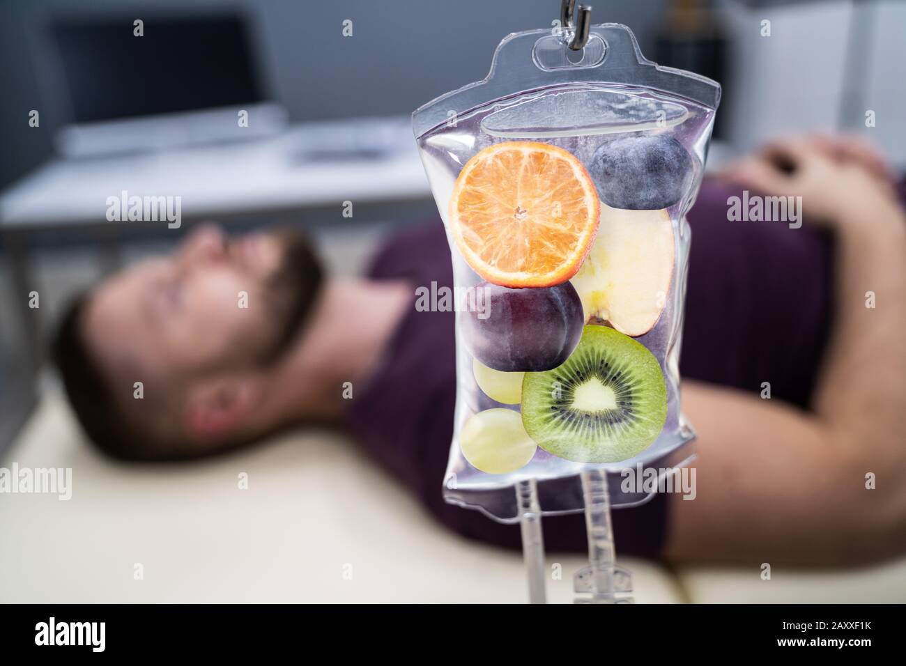 Man In In Hospital Getting IV Infusion Of Fruit Slices Inside Saline ...