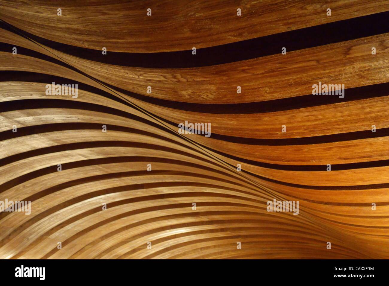 Architectural structure in wood with an andulated brown shape ...