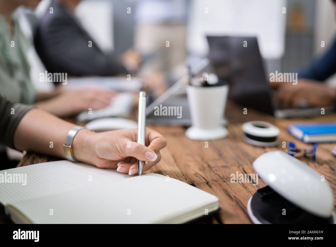 Group Of Business Executives Taking Notes During A Meeting At Office ...