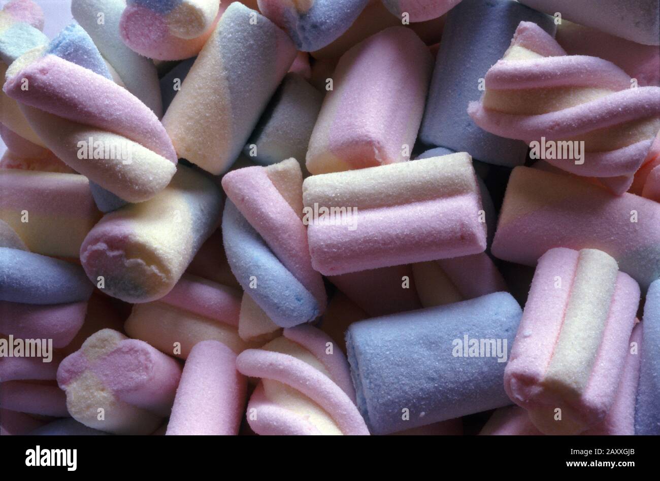 Background of soft spongy multicoloured marshmallows in a random pile ...
