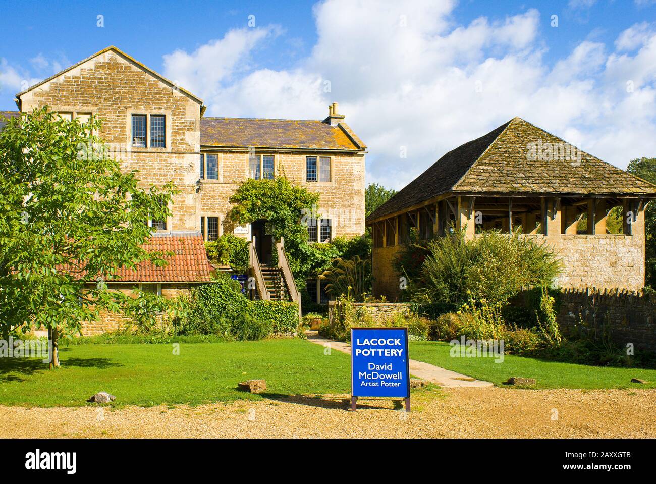A very old building in Lacock village in Wiltshire England UK now used ...