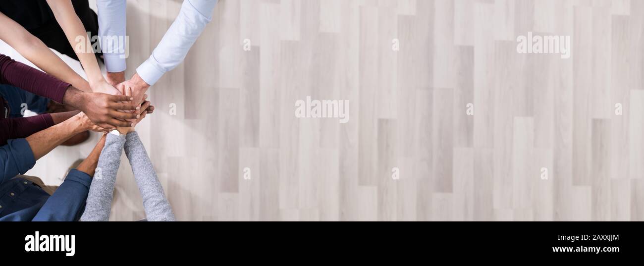 Close-up Of Many Hands Lying On Top Of Each Other Stock Photo - Alamy