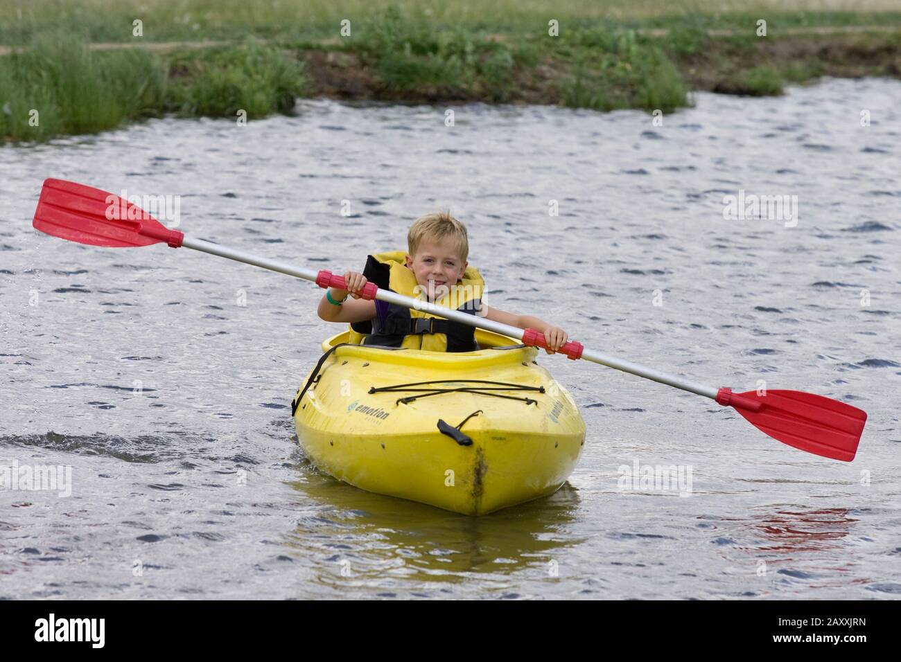 A young boy in a kayak Stock Photo - Alamy