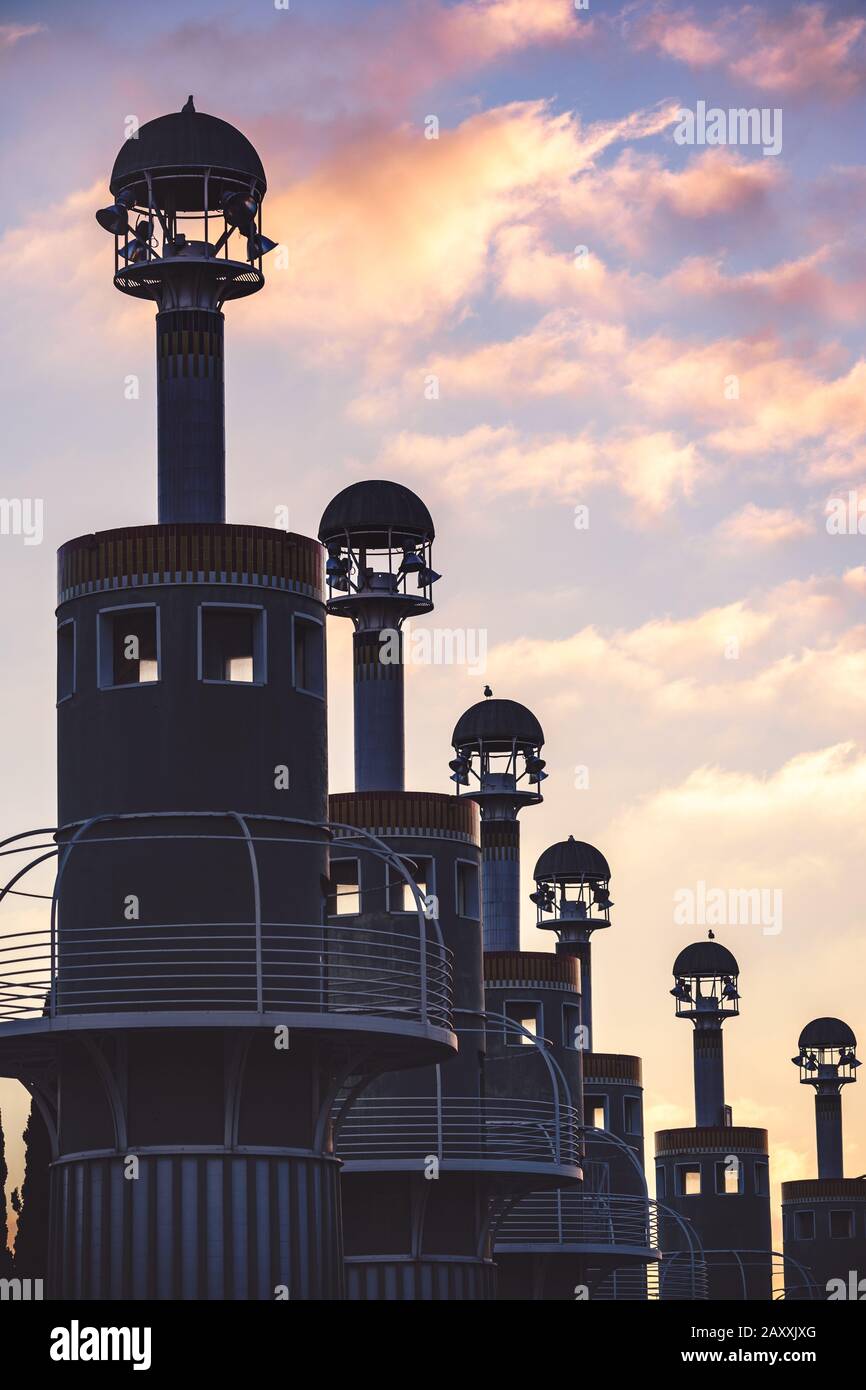 Lighting towers in a city park under the sunset sky Stock Photo - Alamy