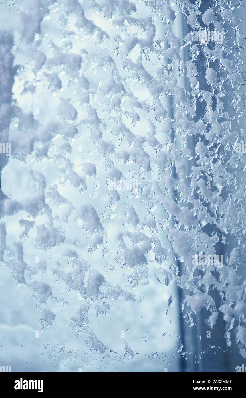 Winter frozen window glass. Texture frozen window glass. Blue frozen ...