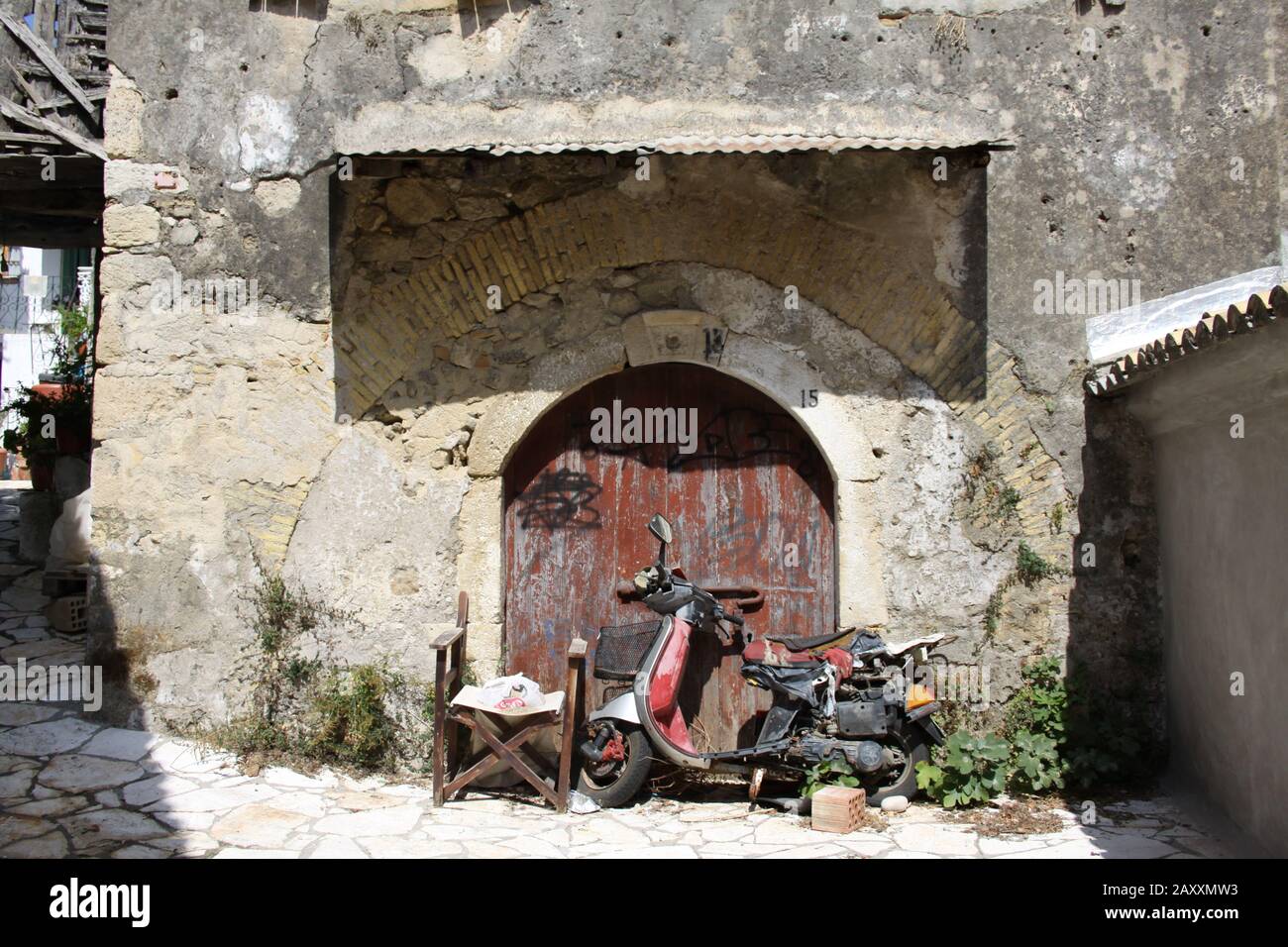 An old motorcycle against a stone wall hi-res stock photography and ...