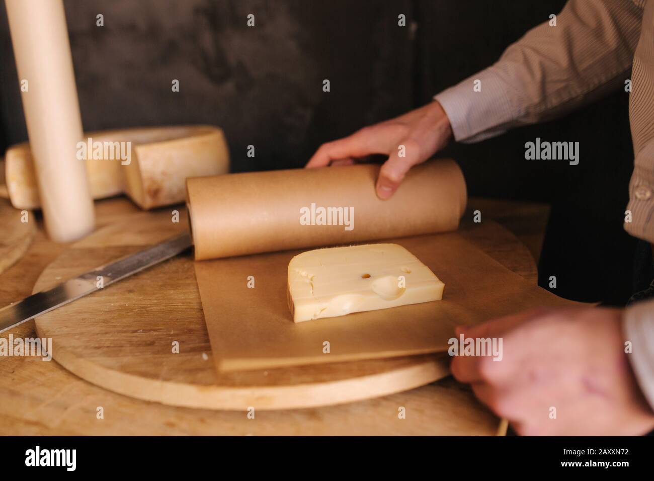 Young man cheese wheel hi-res stock photography and images - Alamy