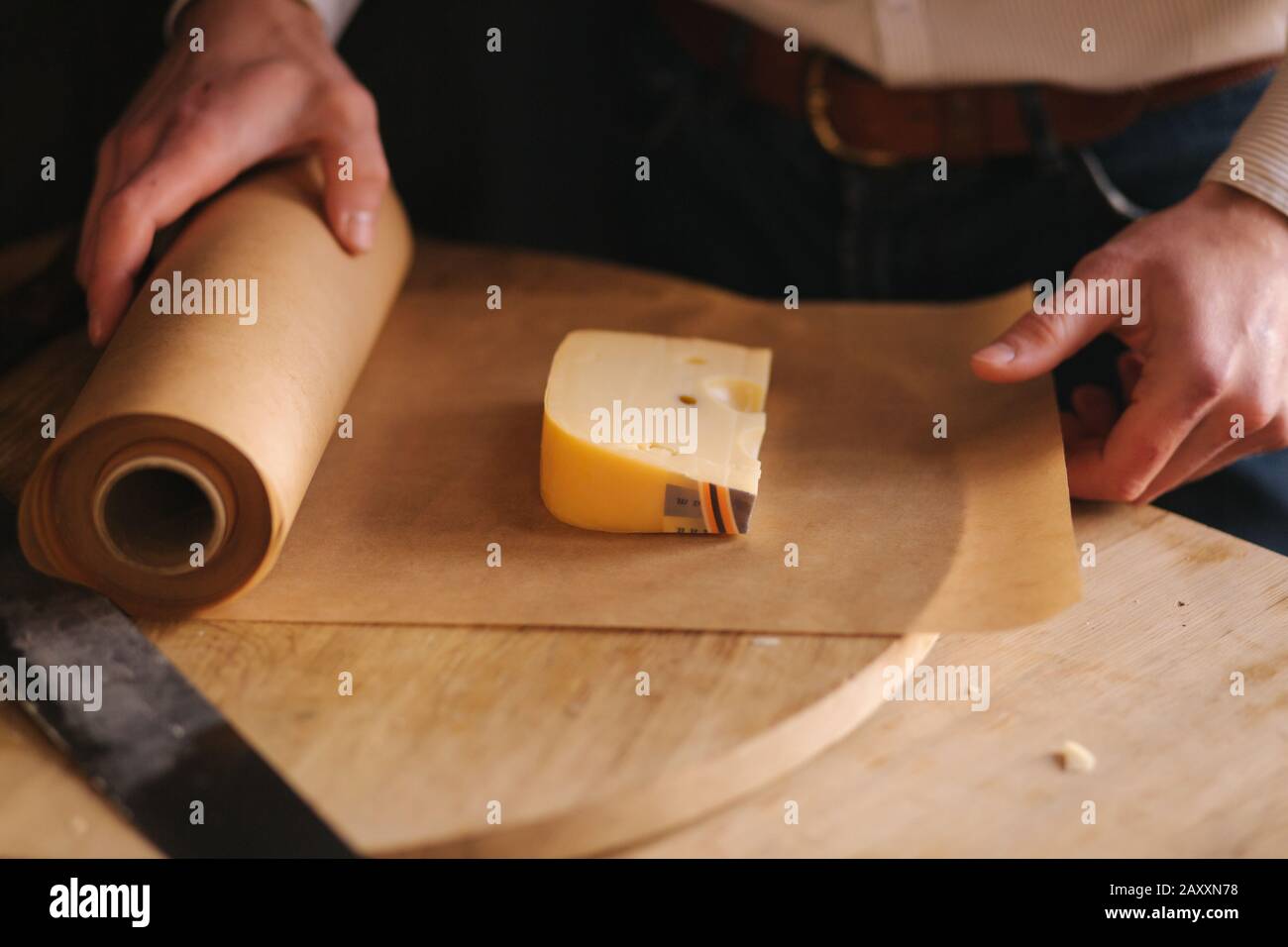 Young man cheese wheel hi-res stock photography and images - Alamy