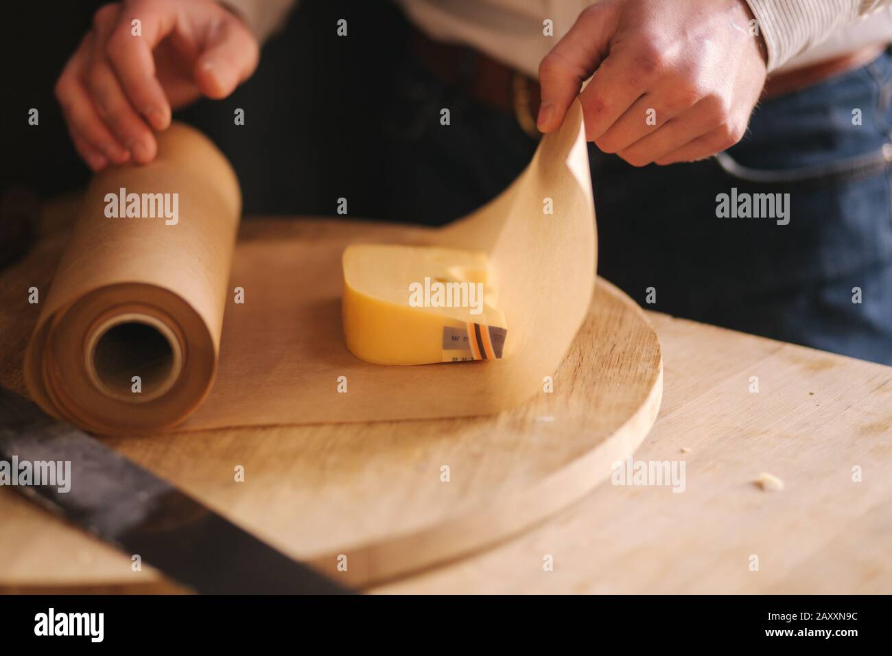 Young man cheese wheel hi-res stock photography and images - Alamy