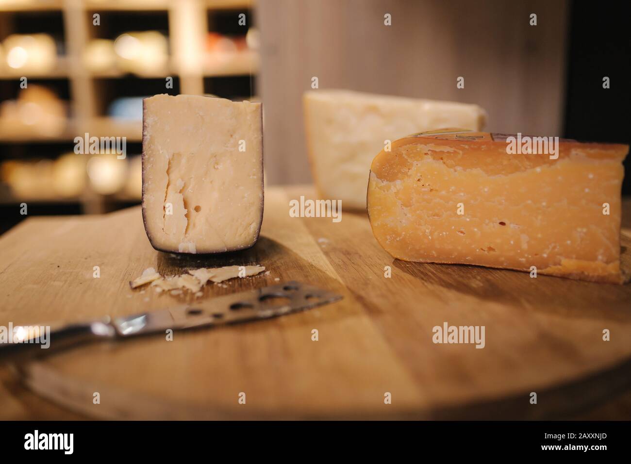 Different types of aged cheese on wooden board Stock Photo - Alamy