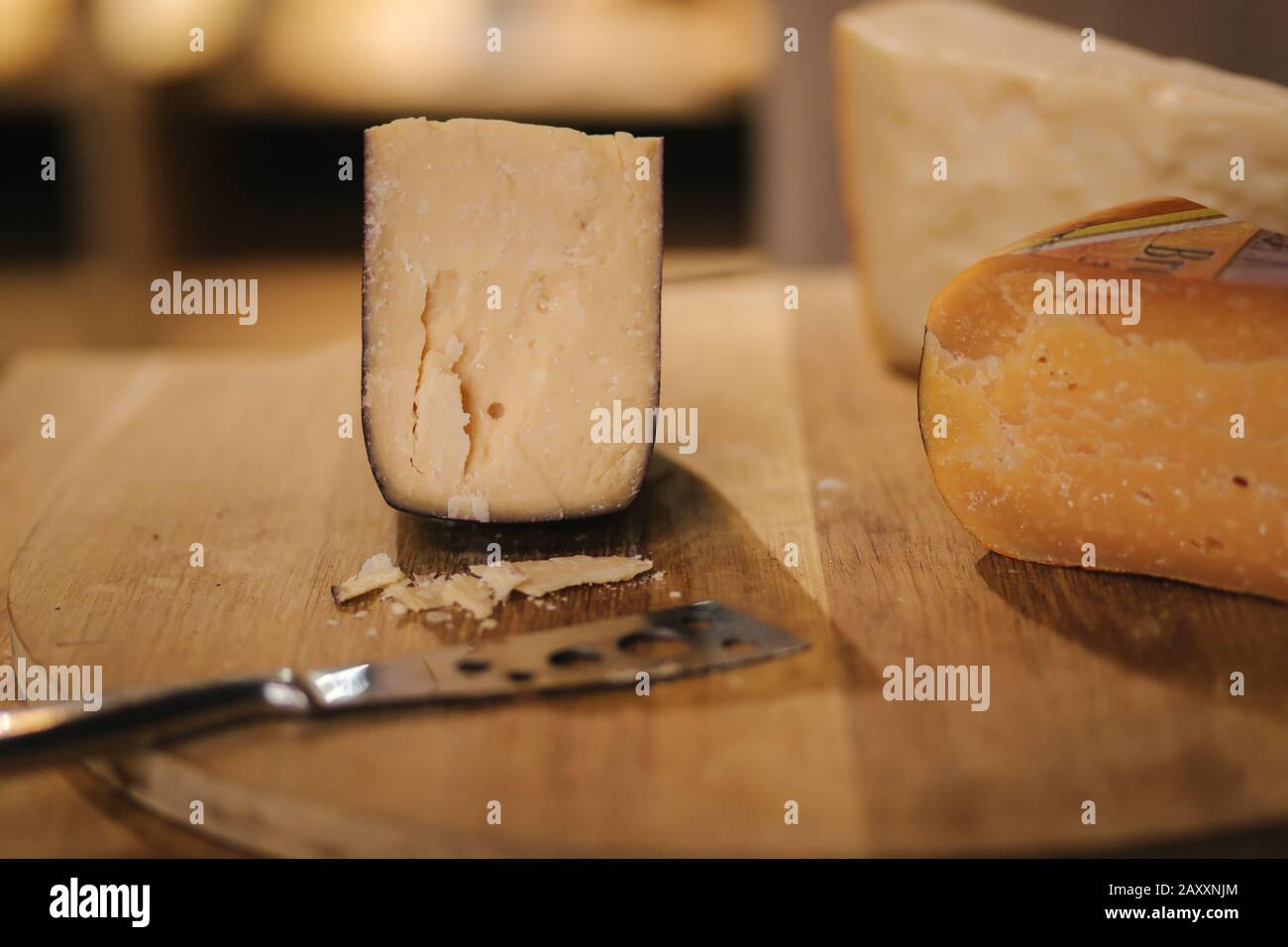 Different types of aged cheese on wooden board Stock Photo - Alamy