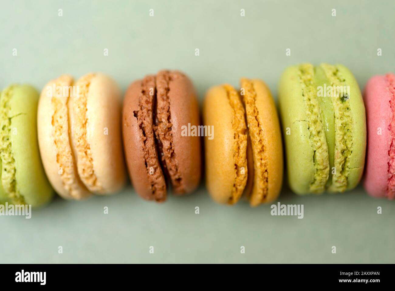 Above view of colorful macaroons on a marble countertop Stock Photo - Alamy