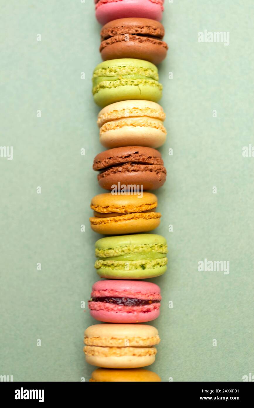 Above view of colorful macaroons on a marble countertop Stock Photo - Alamy