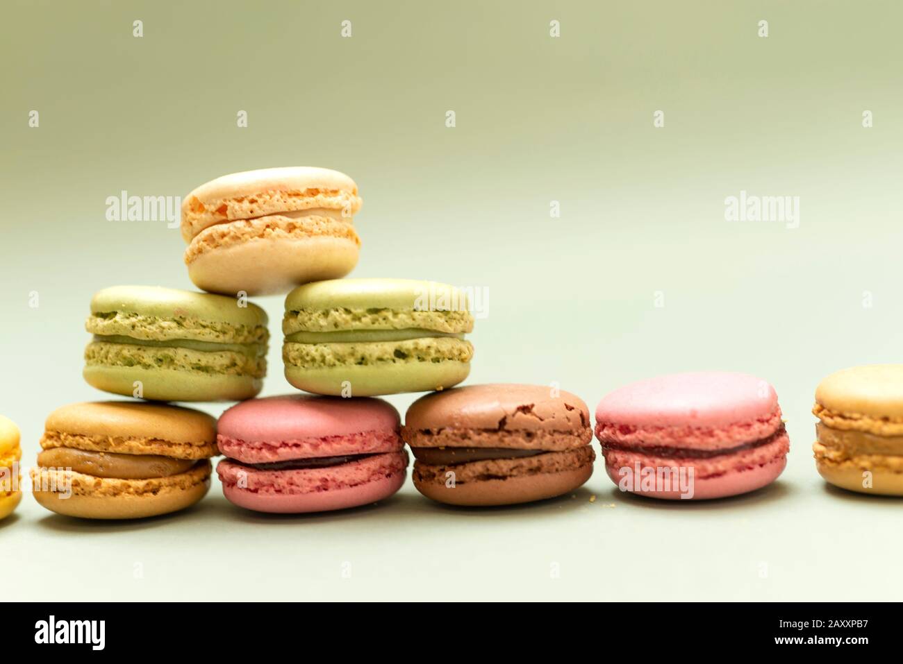 Front view of colorful macaroons on a marble countertop Stock Photo - Alamy