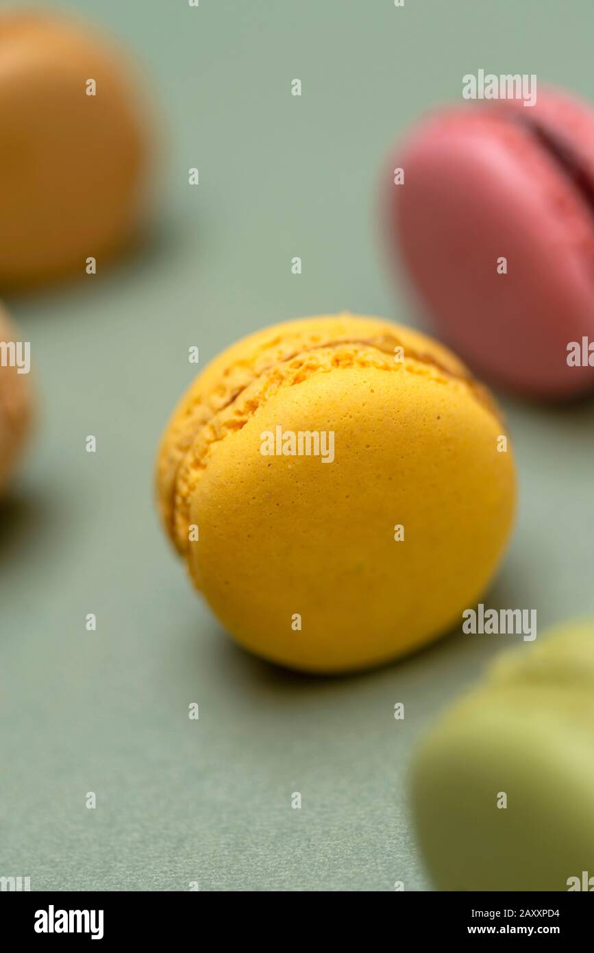 Above view of colorful macaroons on a marble countertop Stock Photo - Alamy