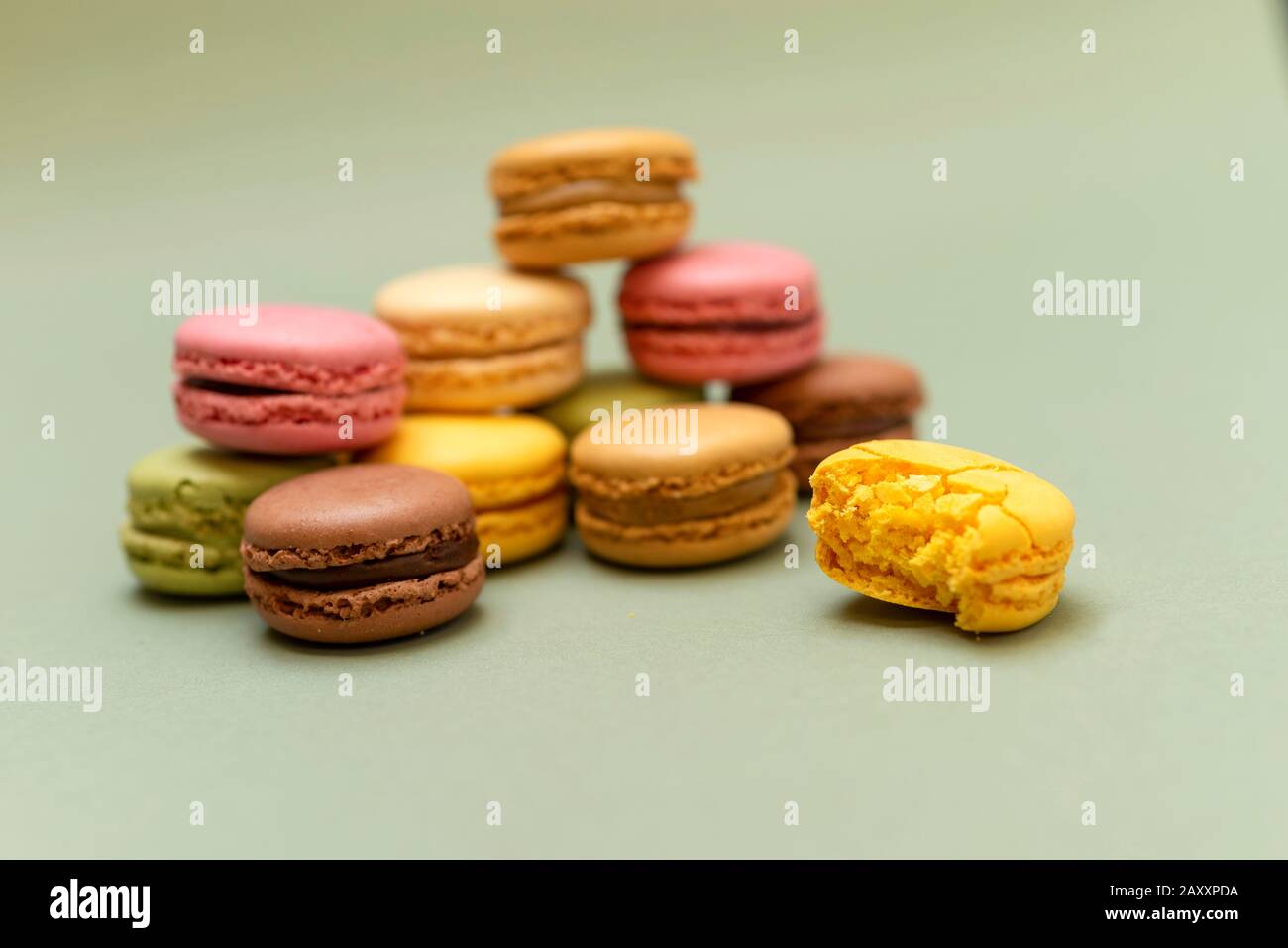 Front view of colorful macaroons on a marble countertop Stock Photo - Alamy