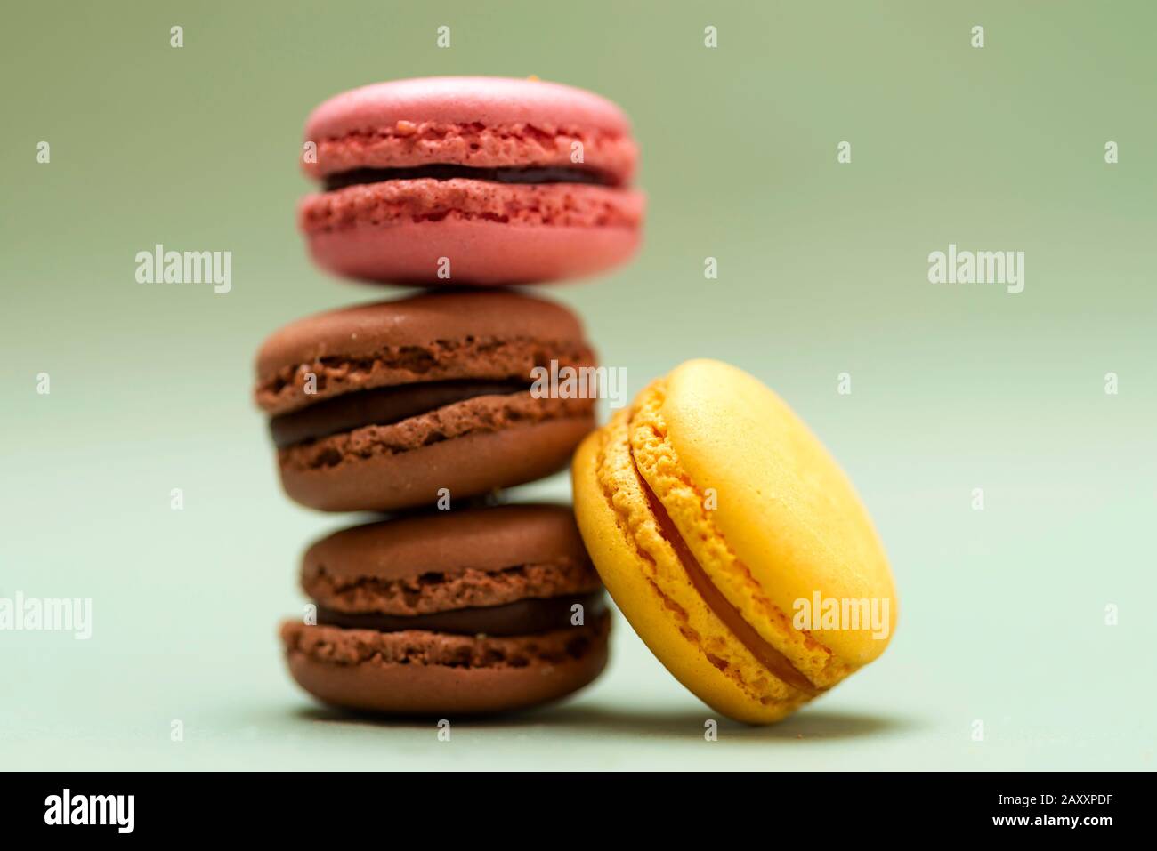 Front view of colorful macaroons on a marble countertop Stock Photo - Alamy
