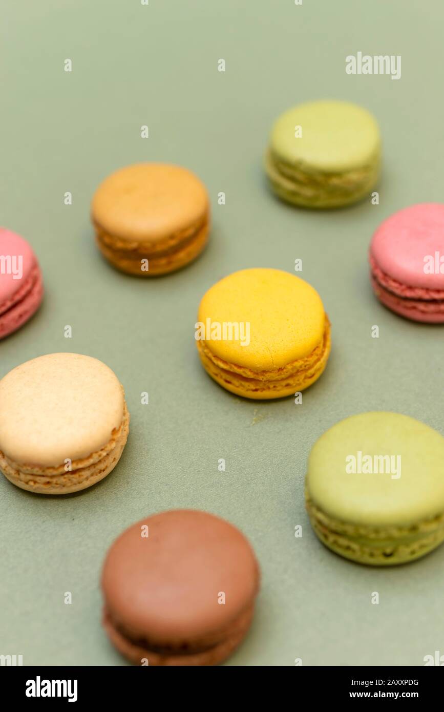 Above view of colorful macaroons on a marble countertop Stock Photo - Alamy