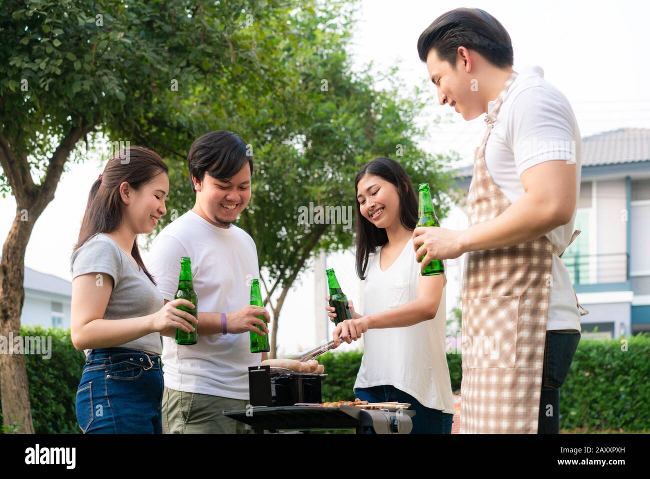 Group people having barbecue hi-res stock photography and images - Alamy