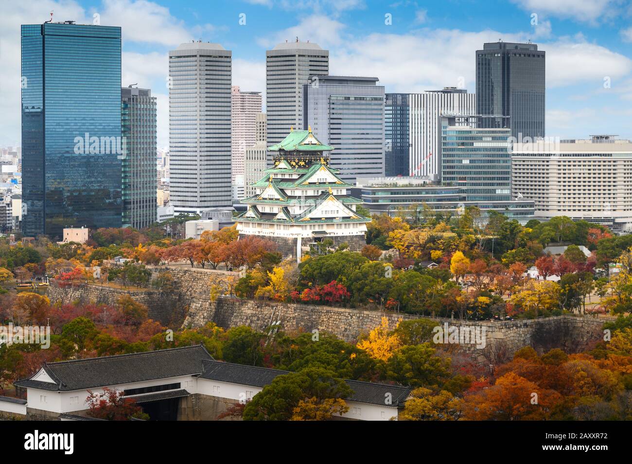 Osaka Castle with Japanese garden and city office building skyscraper ...