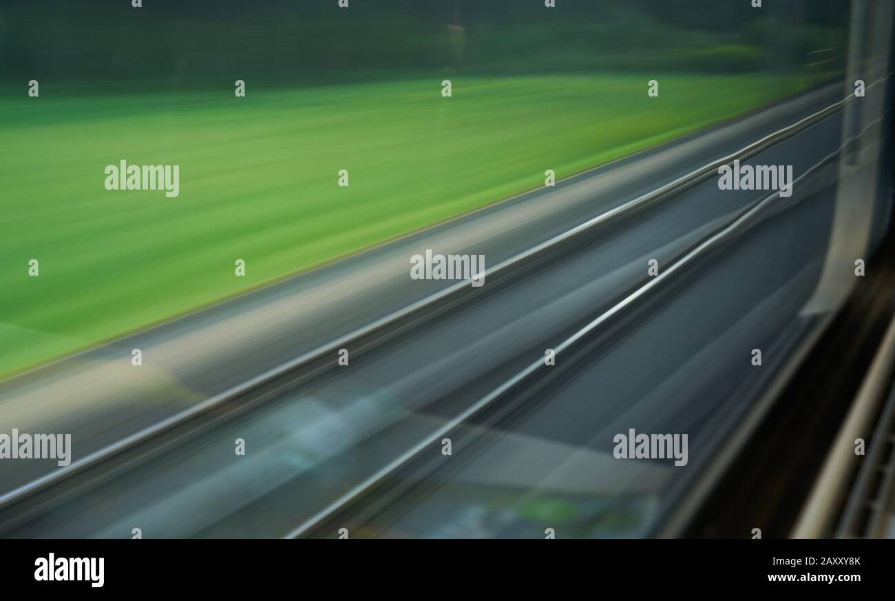 a blurred texture of the railway through the train window Stock Photo ...